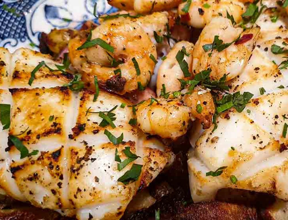 Baked Pollock with Tomatoes and Feta - Walter Purkis and Sons